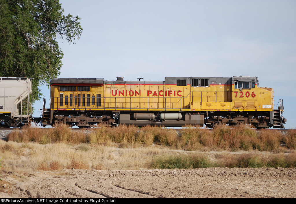 UP 7206 DPU pushes on covered hopper unit train